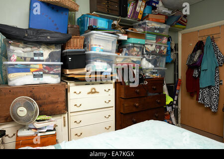 Bedroom filled with clutter Stock Photo - Alamy