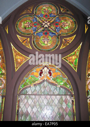 A beautifully intricate stained glass design featuring a heraldic ...
