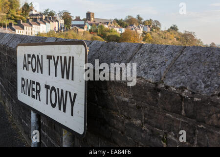 Afon Tywi/River Towy sign on the bridge looking towards the colourful ...