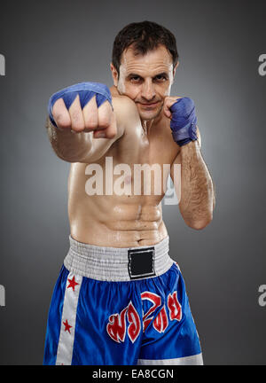 Punch, boxing match or strong man fighting in sports training, body ...