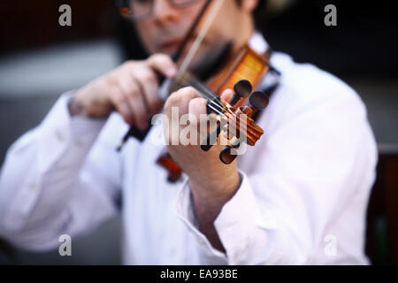 Detail of violin being played by a musician Stock Photo - Alamy