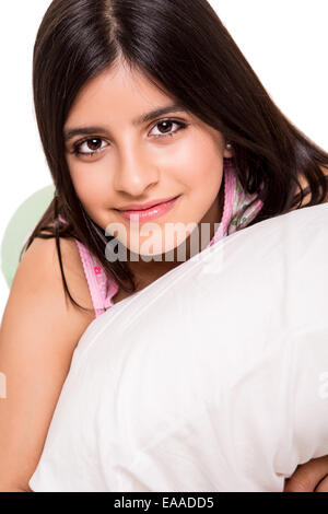 Little cute girl grabbing pillow over white Stock Photo - Alamy