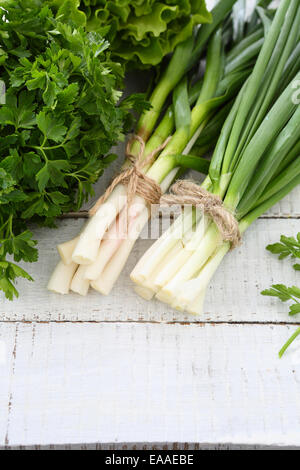 Bunch of parsley stem on a wooden cutting board Stock Photo - Alamy