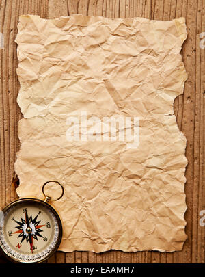 Old paper scroll with compass Stock Photo - Alamy