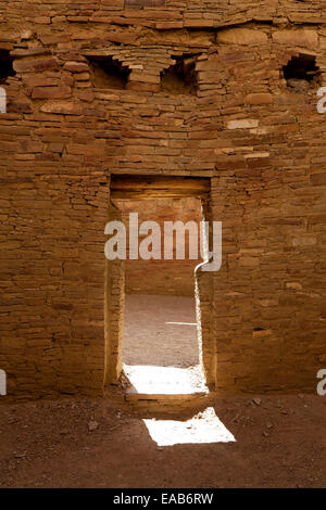 Light shines through a doorway within Pueblo Bonito at Chaco Culture ...