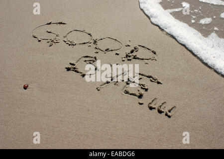 Good bye written on the sand Stock Photo - Alamy