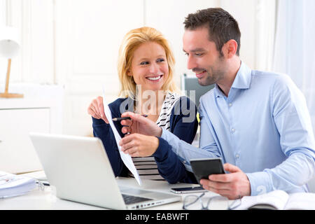 COUPLE DOING PAPERWORK Stock Photo - Alamy