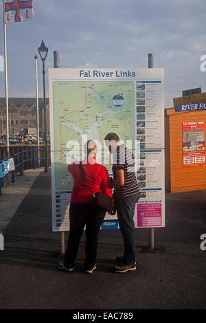 People looking at a map of River Fal transport links Prince of Wales ...