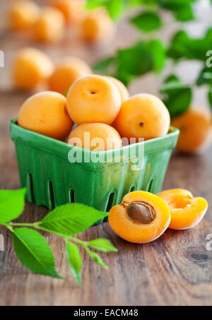 Fresh apricots in bowl on table Stock Photo - Alamy