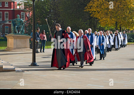 Members of the Christian Anglican clergy clergymen vicars walking to ...