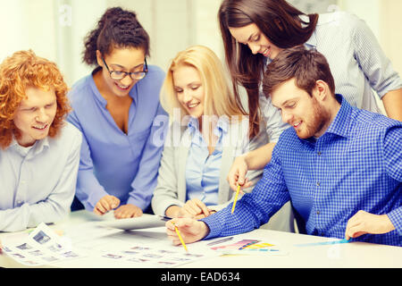smiling team with color samples at office Stock Photo - Alamy