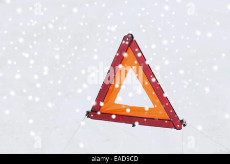 warning triangle on snow Stock Photo - Alamy