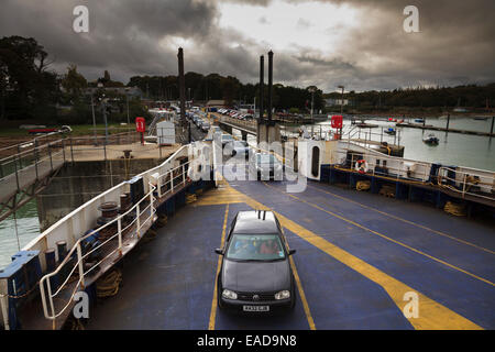 Vehicles loading down boarding ramp onto car ferry Stock Photo - Alamy