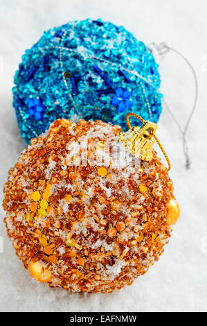 Different Christmas balls and sequins on color background Stock Photo ...