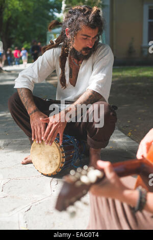 Street musicians playing guitar and drum Stock Photo - Alamy