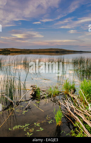 Scenic summer views of a prairie lake at sunset and sunrise, Police ...