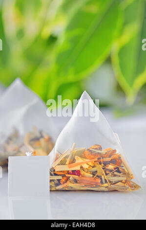 Tea bags on wooden background with fresh melissa, mint. Tea with mint ...