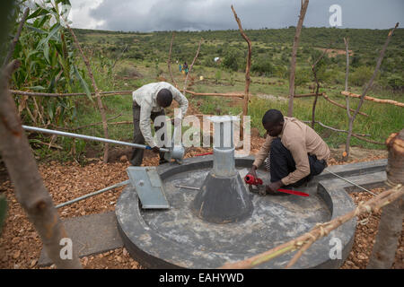 Community members in Sukuroi village, Bukwo District, Uganda work to ...