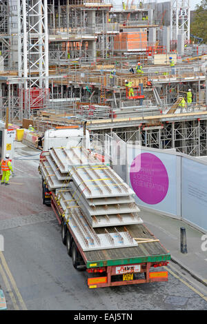 Construction site entrance articulated lorry load of steel ...