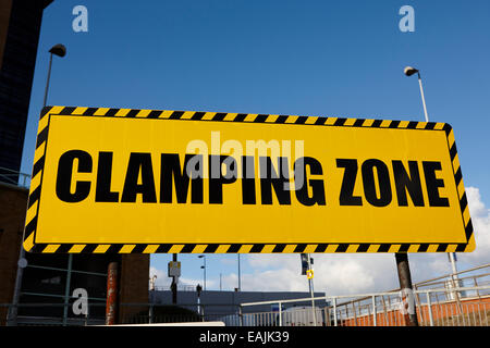 yellow black clamping zone warning sign Belfast Northern Ireland UK ...