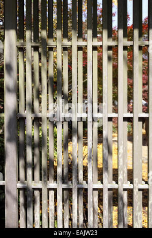 A traditional wooden Japanese house with a lattice front on a back ...