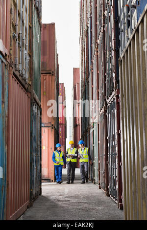 A vertical shot of a Caucasian young male jumping in the park wearing a ...