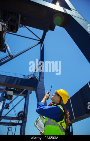 Low angle side view of serious Hispanic man in elegant suit standing on ...