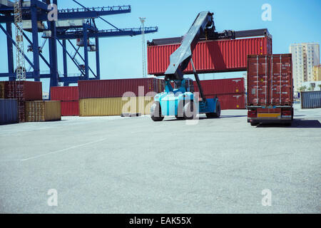Crane lifting shipping container Stock Photo - Alamy