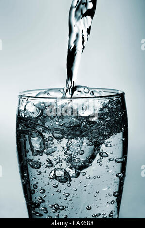 water glass being filled with fresh water Stock Photo - Alamy