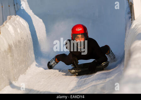 Man riding a skeleton sled at the Innsbruck bobsleigh track, Igls ...