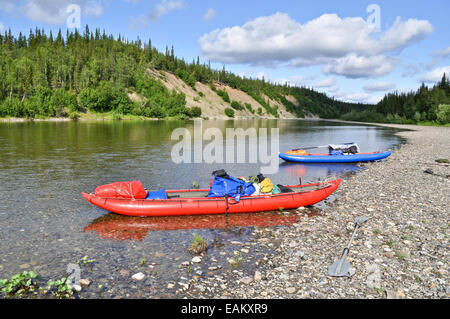 Inflatable kayaks on the shore taiga rivers. The river of the polar ...