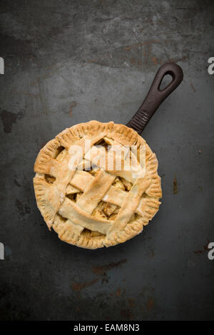 Fresh baked classic American apple pie on dark wooden background. Top ...