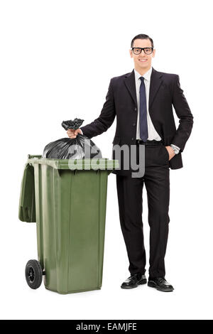 Portrait Of Man Taking Out Garbage In Bags Stock Photo - Alamy