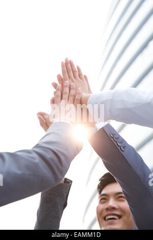 Chinese business people clapping hands in meeting room Stock Photo - Alamy