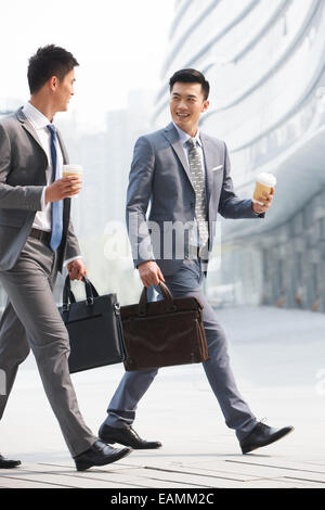 Two business men in a hurry to work Stock Photo - Alamy