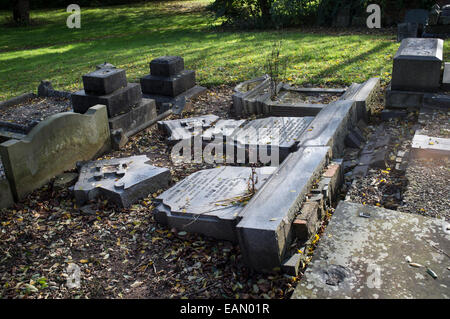 Broken headstones of vandalised graves in churchyard awaiting ...