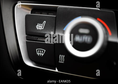 Detail of the heated seats button in a car Stock Photo - Alamy