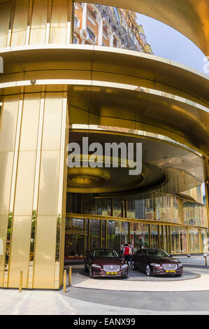 Luxury hotel cars parked outside the gold entrance to the Hotel Lisboa ...