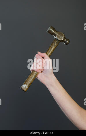 Woman holding hammer Stock Photo - Alamy