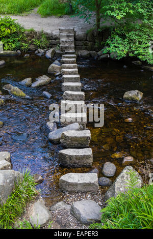 Stepping stones crossing Hebden Beck with the Gibson Mill Toll House in ...
