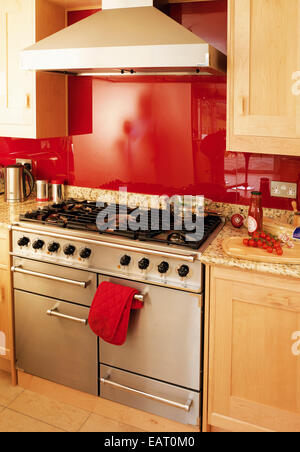 Red range oven in contemporary kitchen with fitted units Stock Photo ...