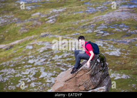 A teenager climbing the Munro on Ben More, Isle of Mull, Scotland, UK ...