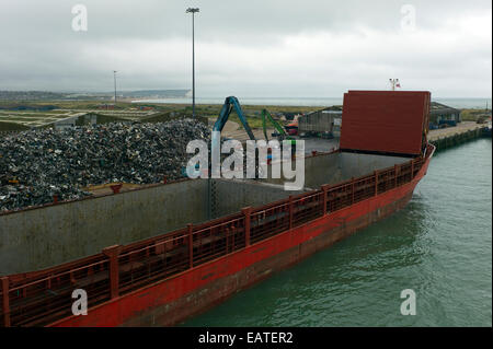 Scrap metal being loaded onto a bulk carrier ship Newhaven, East Sussex ...