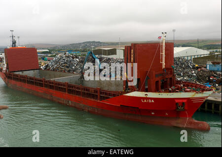 Scrap metal being loaded onto a bulk carrier ship Newhaven, East Sussex ...