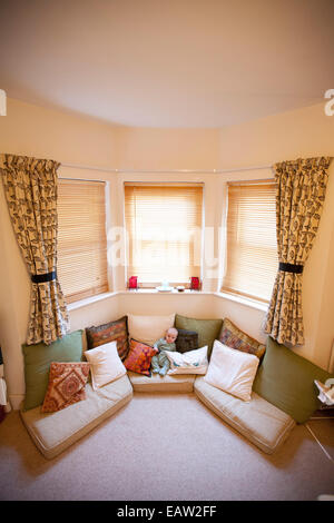Baby boy sitting in the room Stock Photo - Alamy