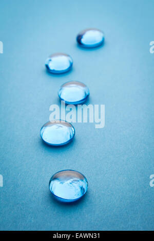 Selective focus on glass beads on a wooden mancala board Stock Photo ...