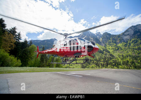 Helicopter is landing after the skydiving session Stock Photo - Alamy
