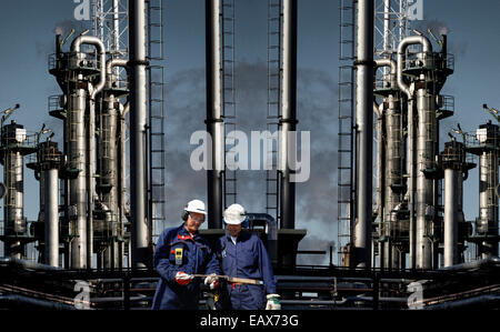 oil and gas workers inside oil refinery Stock Photo - Alamy