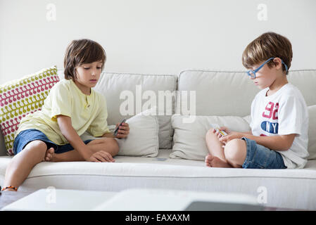 Two brothers playing cards Stock Photo - Alamy