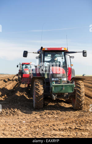 UK, Yorkshire, tractors ploughing field Stock Photo - Alamy